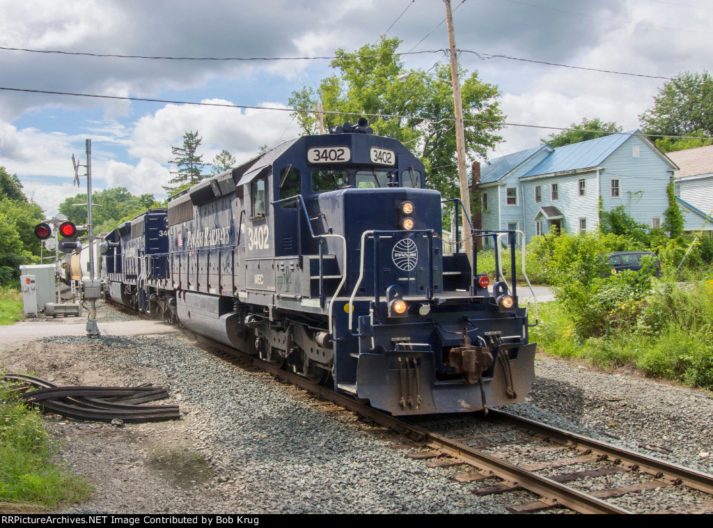 MEC 3402 leads EDRJ over the Carey Avenue grade crossing